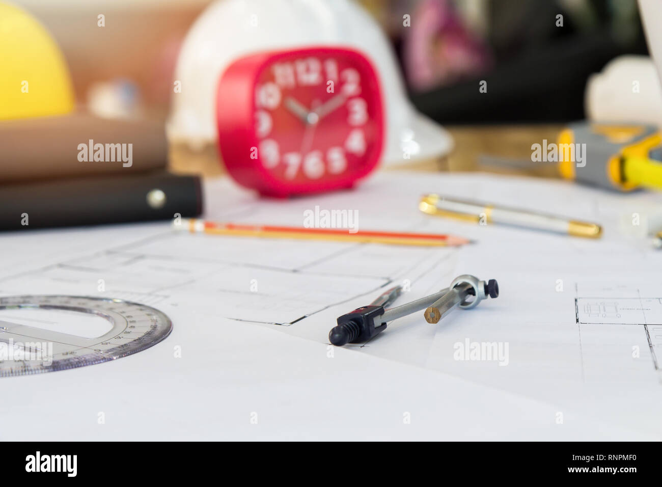 Measurement tool with helmet on blueprint, architectural concept Stock ...