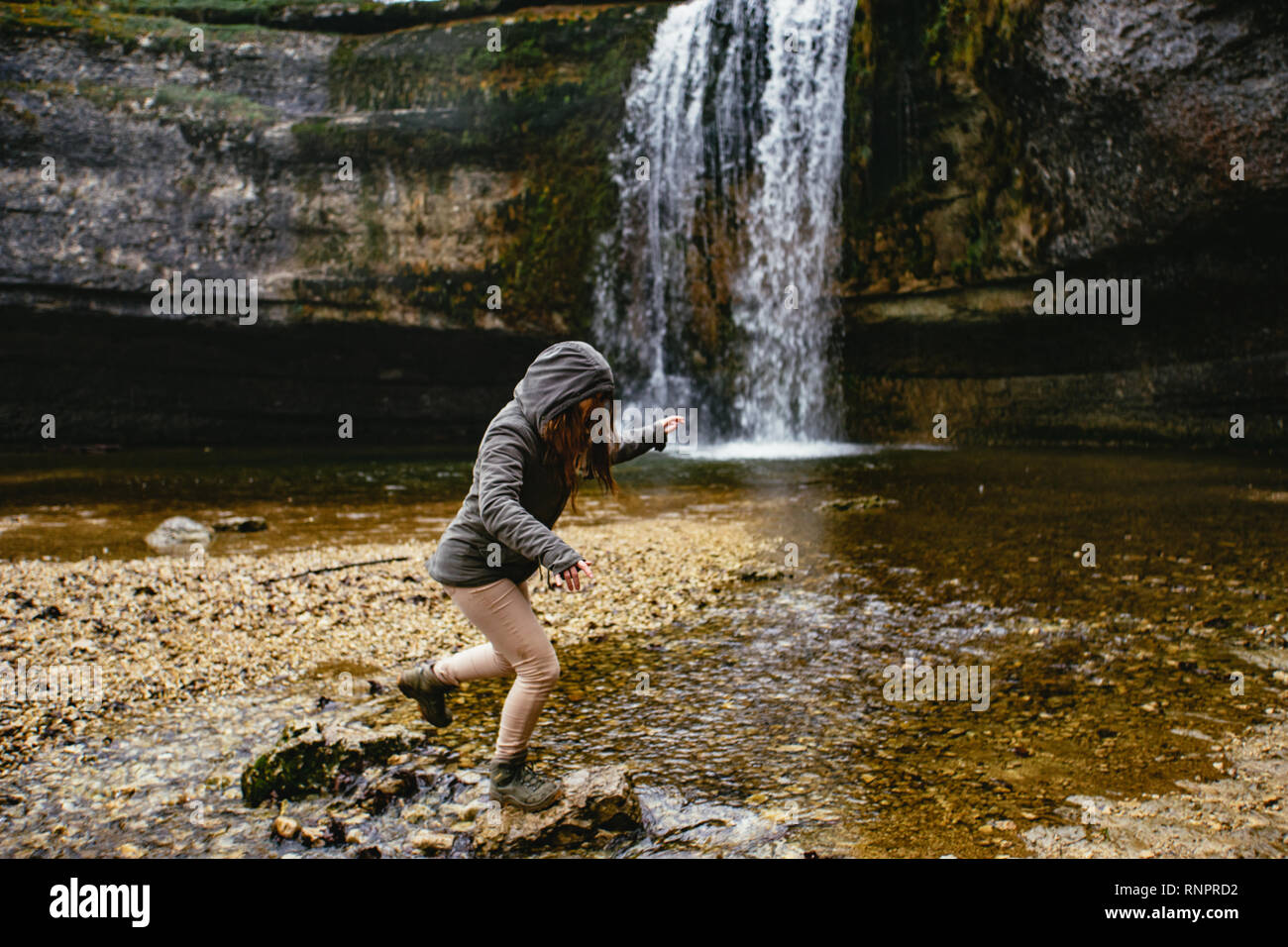 Waterfall in forest. The erosion from the waterfall formed the rock to ...