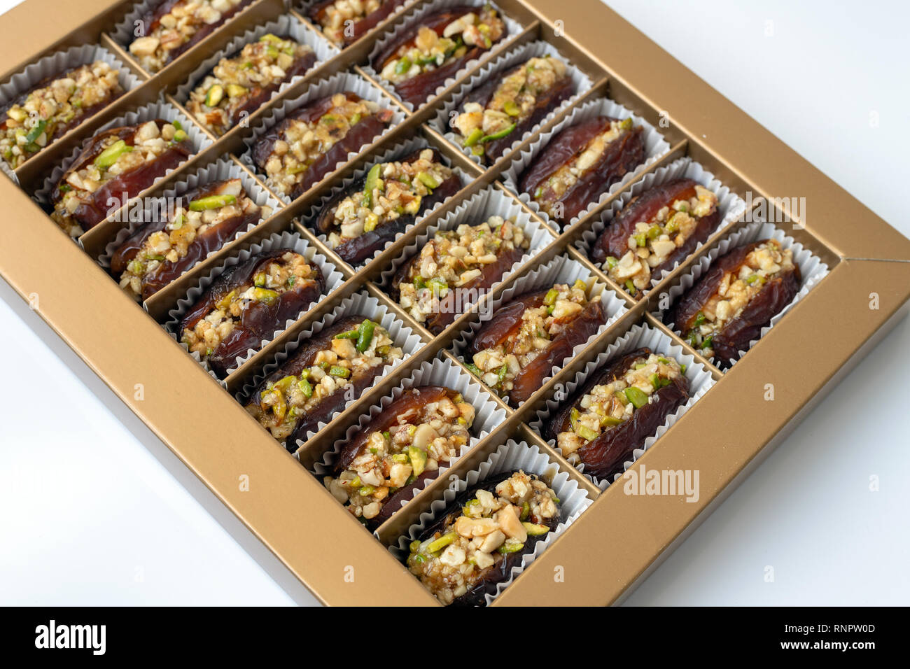 Dates stuffed with pistachios in a box Stock Photo - Alamy