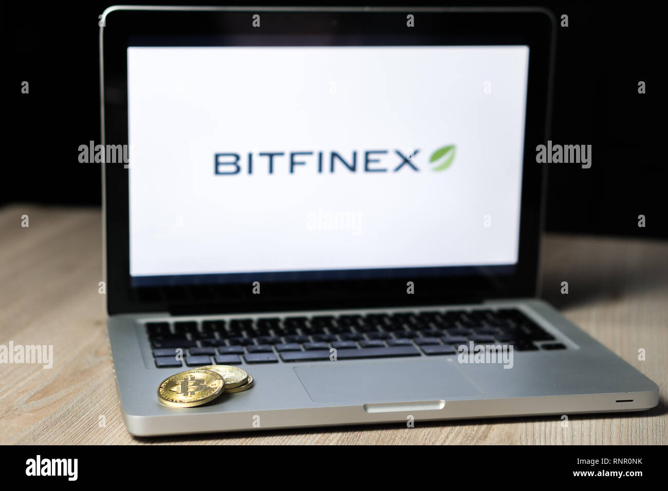 Bitcoin coin with the Bitfinex exchange logo on a laptop screen ...