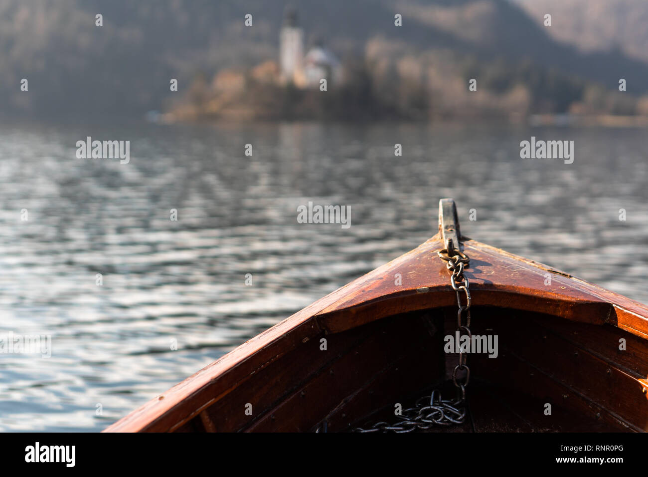 Wooden rent boat on a Bled lake, end of the boat facing towards Lake ...