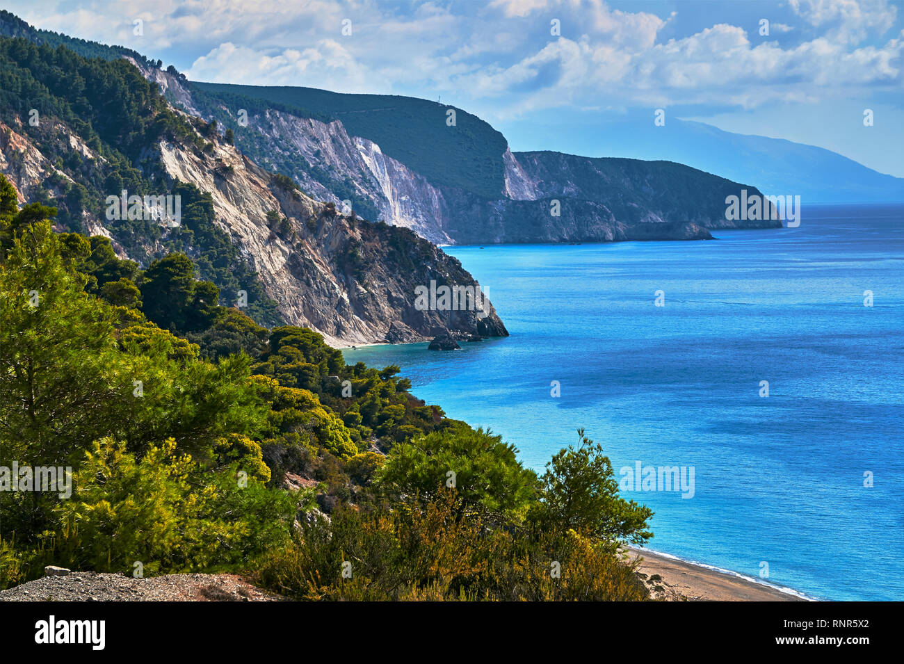Pine trees on a cliff above the sea on the Greek island of Lefkada ...