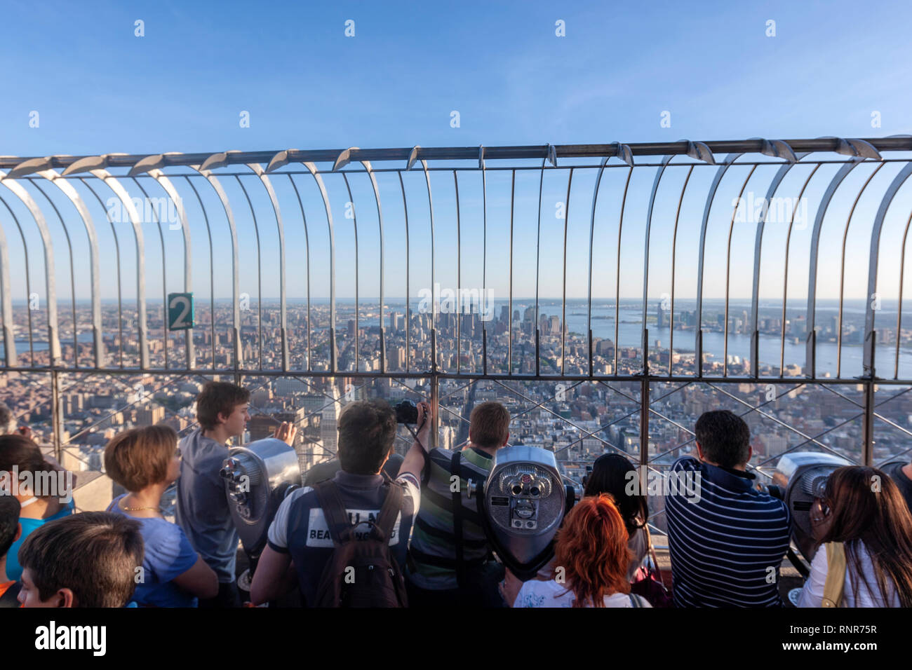 Tourists viewing the Empire State Building's observation deck, Art Deco ...