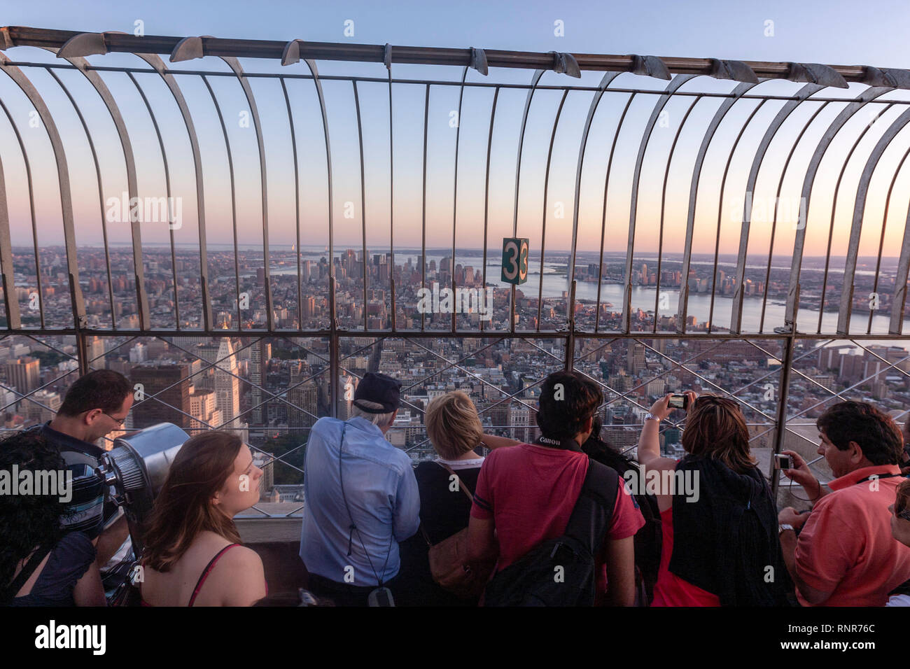 Tourists viewing the Empire State Building's observation deck, Art Deco ...