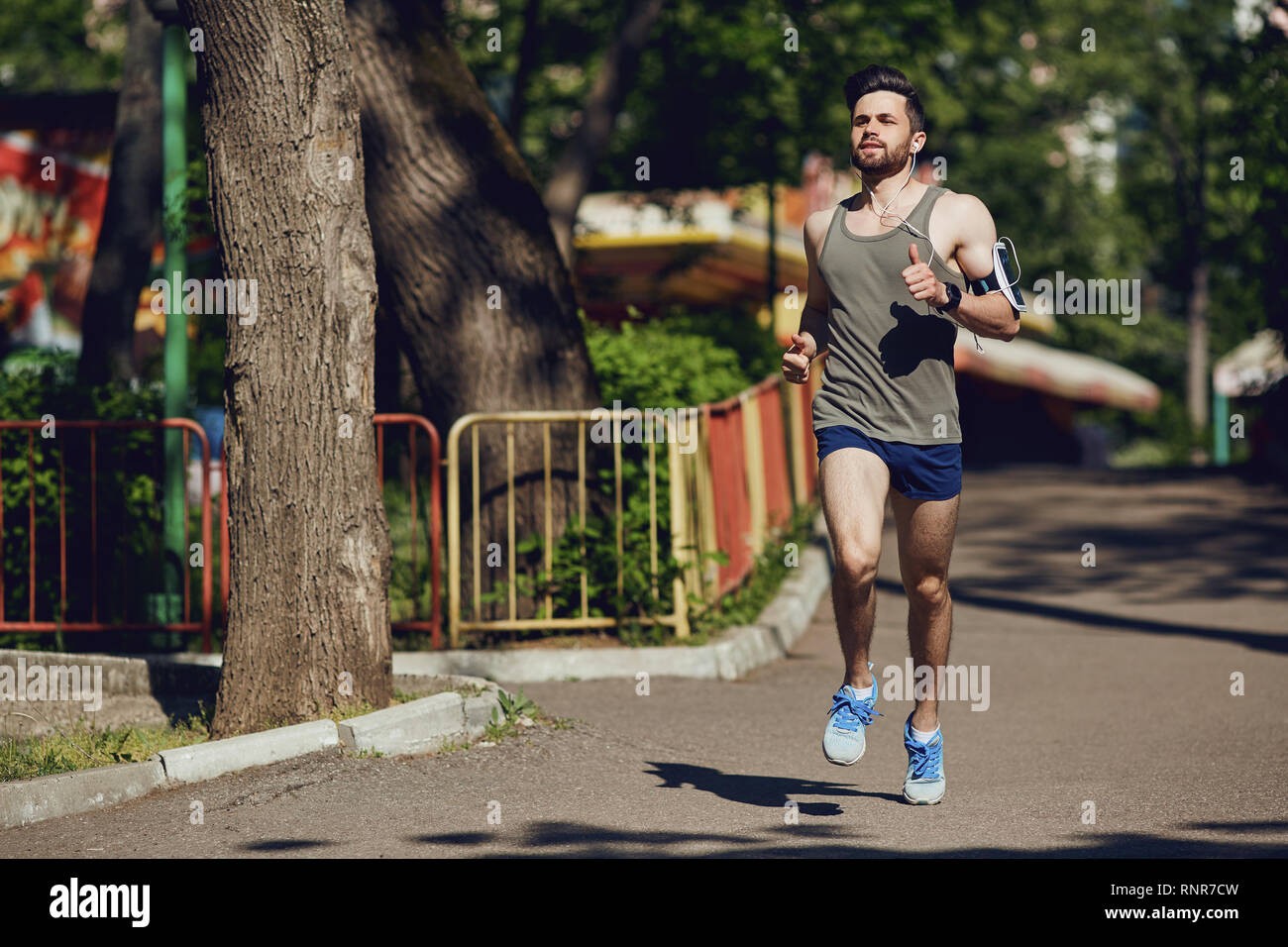Man running along road hi-res stock photography and images - Alamy