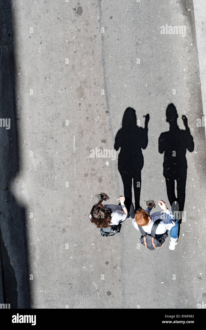 Shadow of a woman and a man walking from above Stock Photo - Alamy
