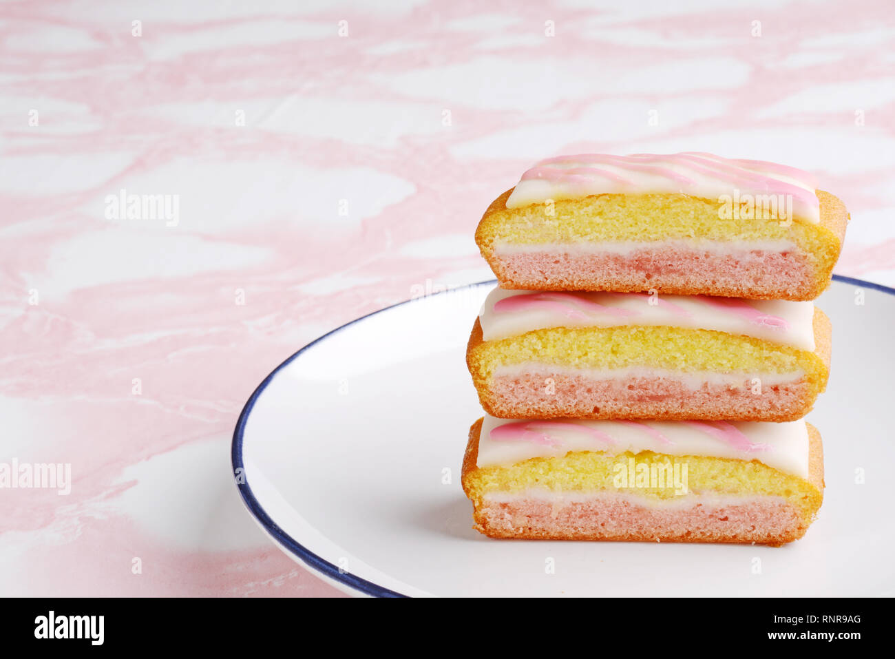 Closeup three slices of english angel cake Stock Photo - Alamy