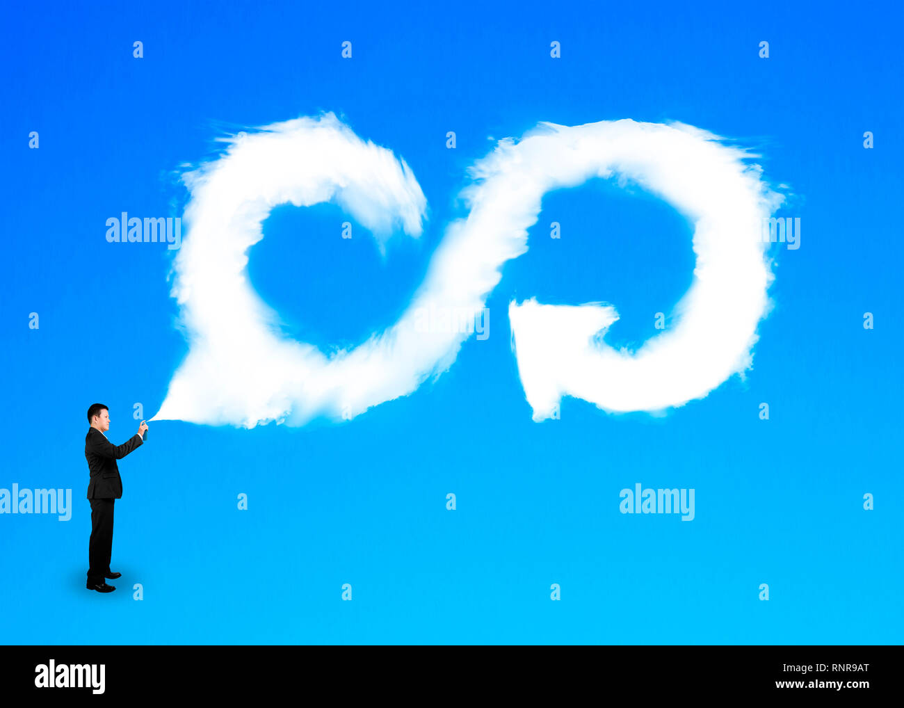 Businessman spraying out clouds in arrow infinity recycling symbol ...