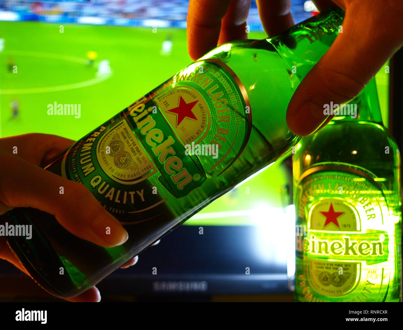 Heineken Beer in the background football game Stock Photo - Alamy