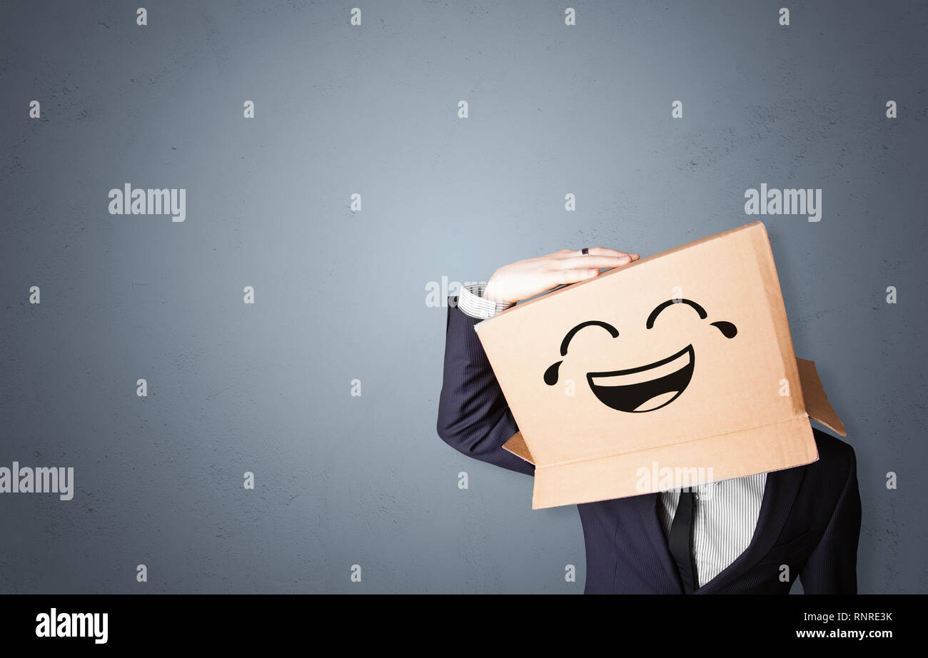 Funny man wearing cardboard box on his head with smiley face Stock ...