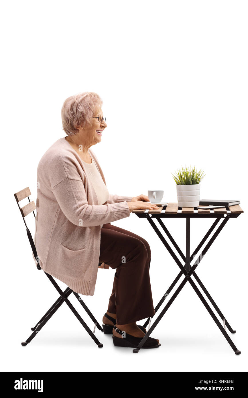 Elderly people sitting table woman Cut Out Stock Images & Pictures - Alamy