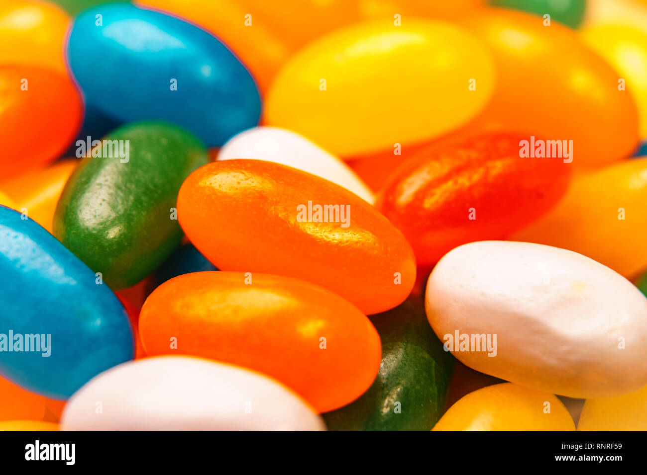 Jelly bean pile, assorted jelly beans macro shot Stock Photo - Alamy