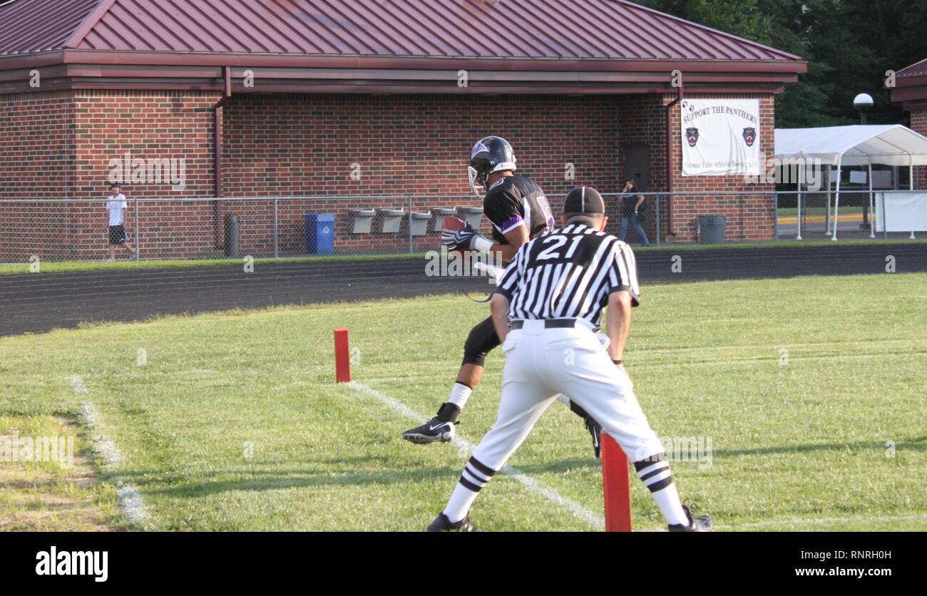 American high school football player in Virginia secures a long pass ...