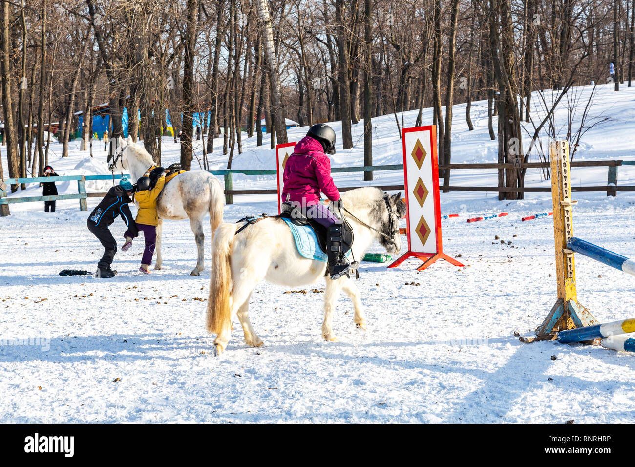 Child riding horse helmet park hi-res stock photography and images - Alamy