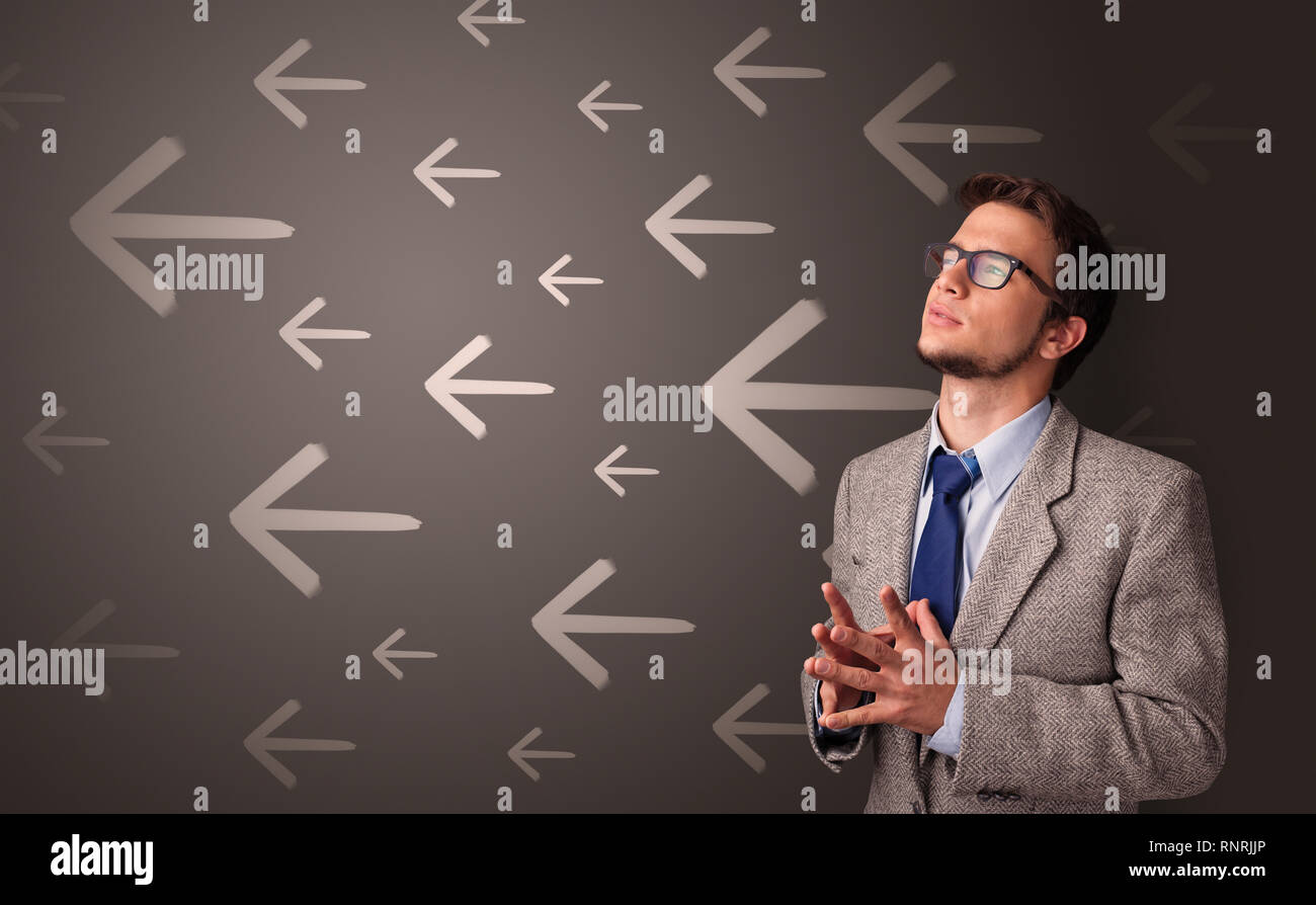 Young person thinking with direction concept background Stock Photo - Alamy
