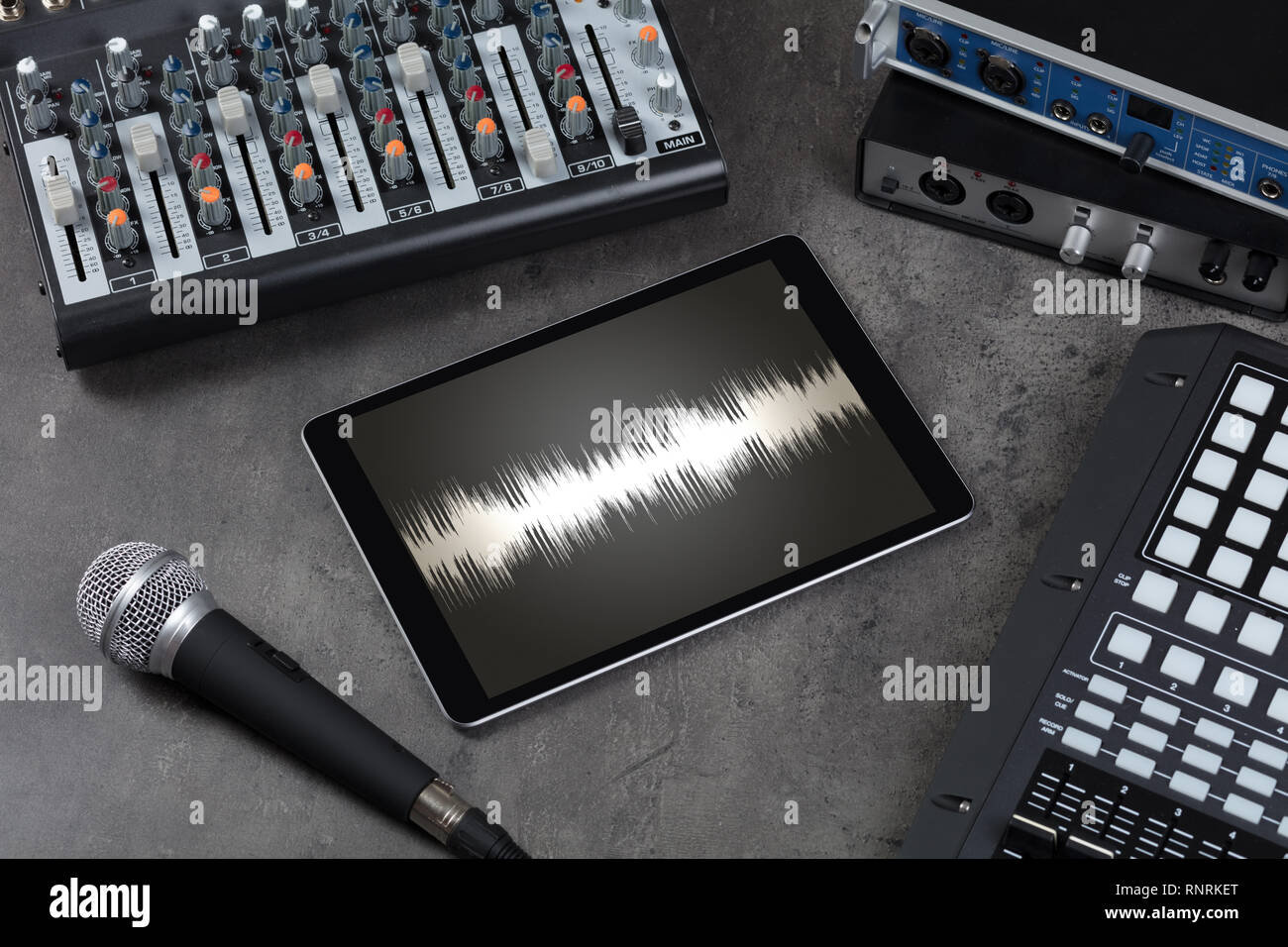 Recording music with tablet and electronic music instruments Stock ...