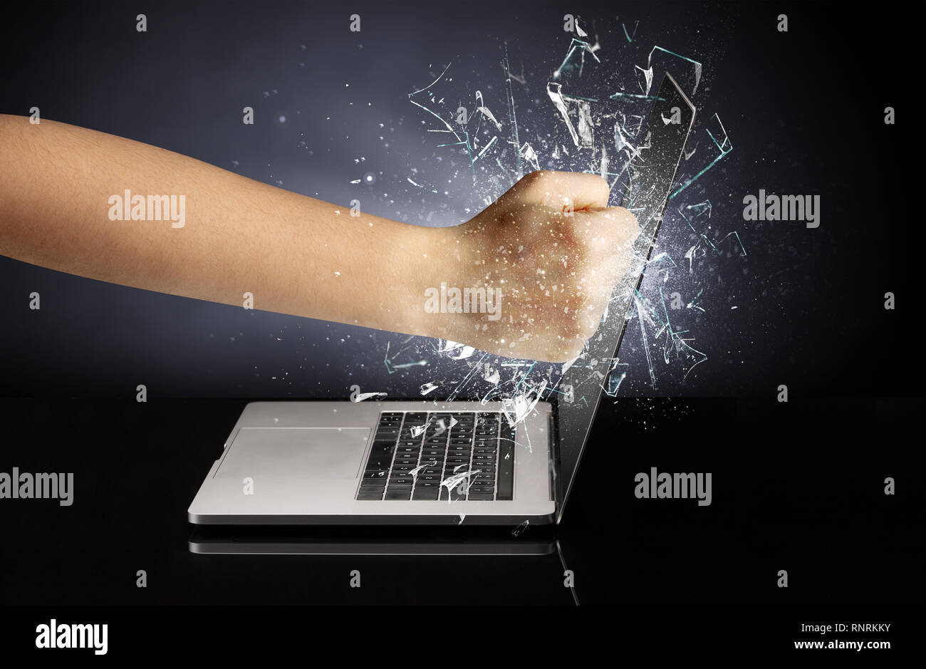 Hand hitting strongly laptop screen glass Stock Photo - Alamy
