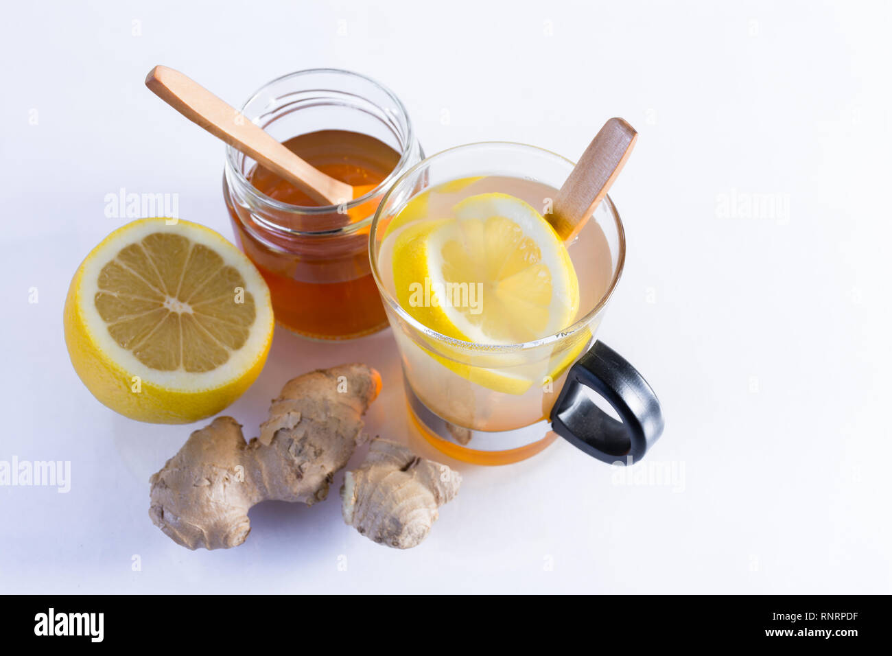 Still life of ginger infusion with ingredients, lemon and honey on a ...