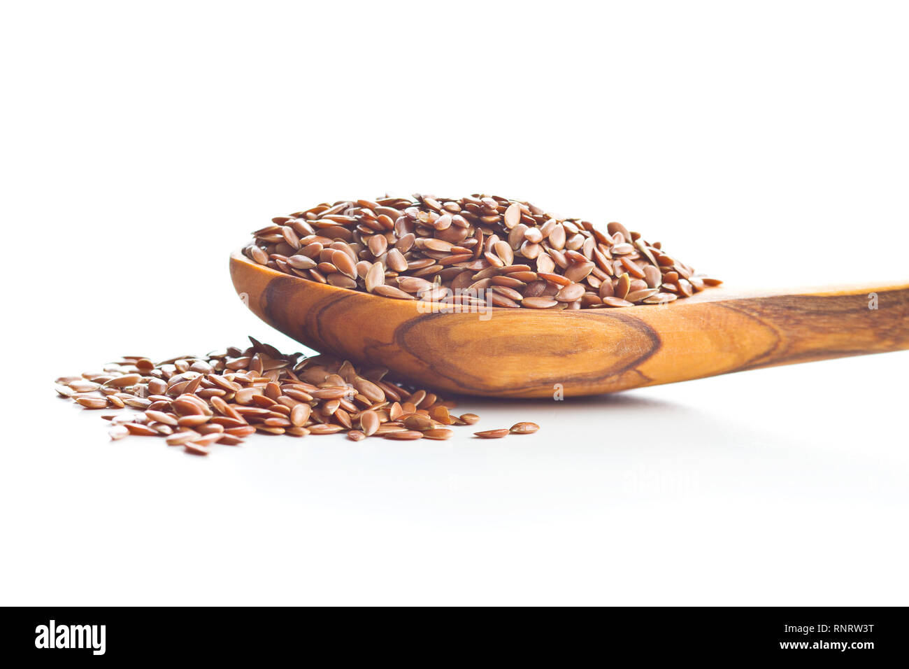 Flax seeds, linen seeds or linseeds in spoon isolated on white background Stock Photo - Alamy