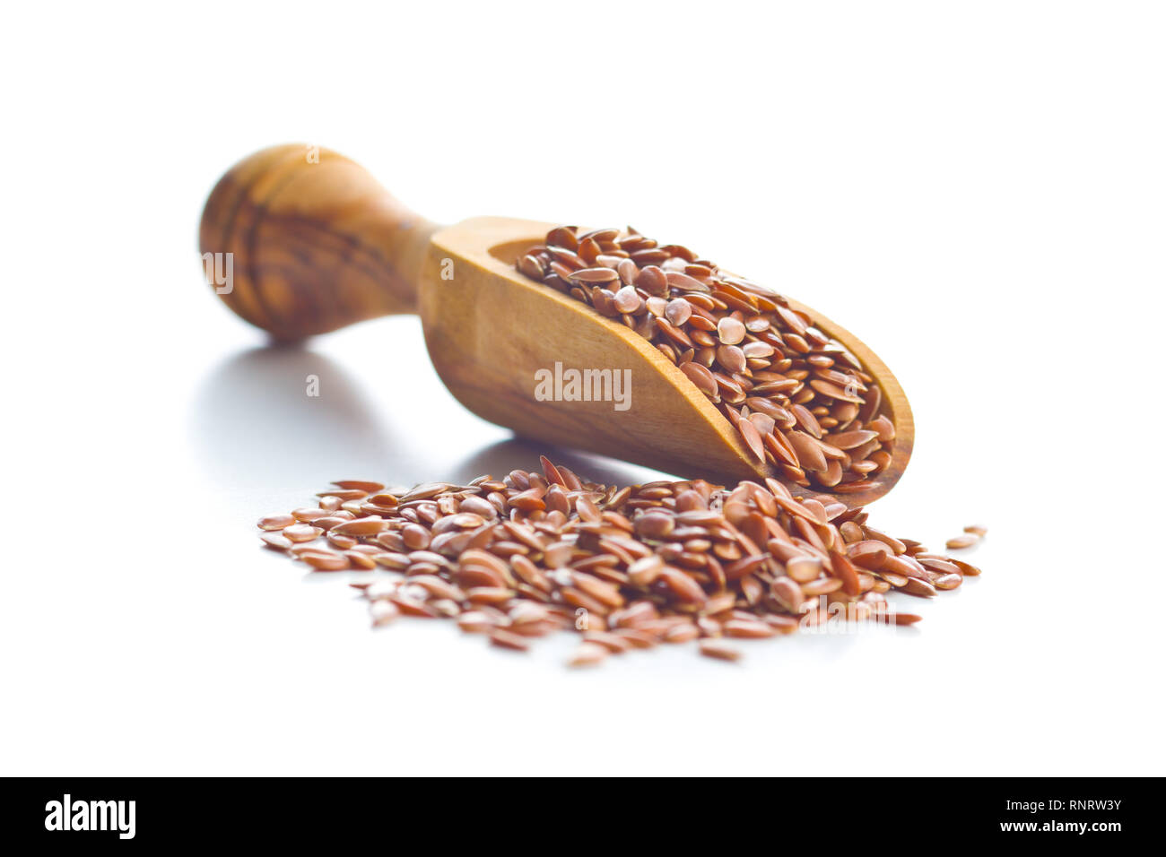 Flax seeds, linen seeds or linseeds in scoop isolated on white background Stock Photo - Alamy