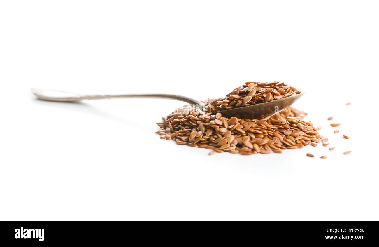 Flax seeds, linen seeds or linseeds in spoon isolated on white background Stock Photo - Alamy