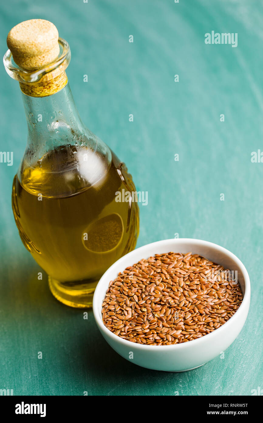 Flax seeds, linen seeds or linseeds and oil Stock Photo - Alamy