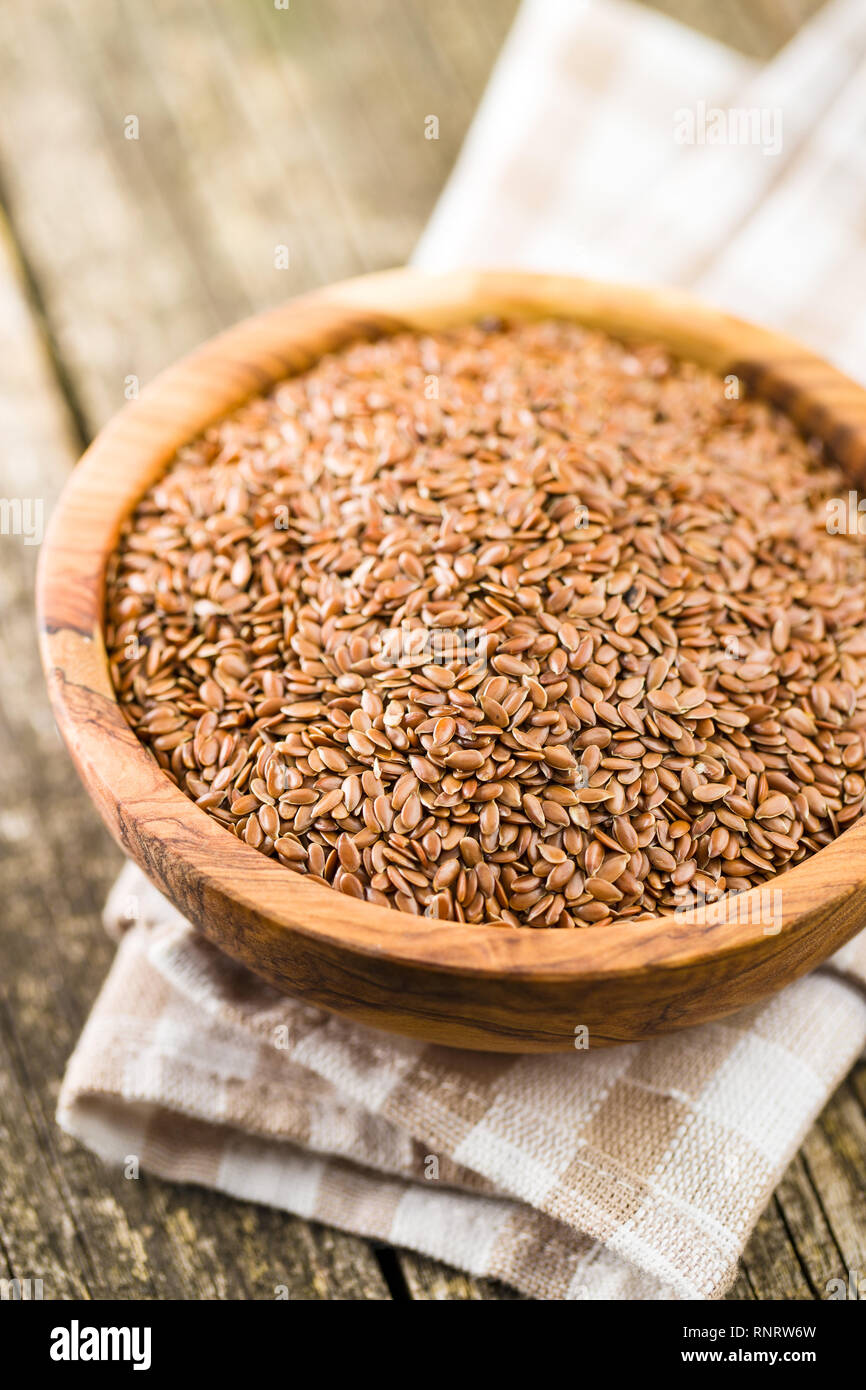 Flax seeds, linen seeds or linseeds in wooden bowl Stock Photo - Alamy