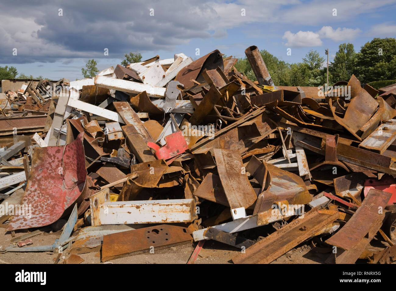 Pile of assorted rusted beams and girders made of ferrous metal in ...