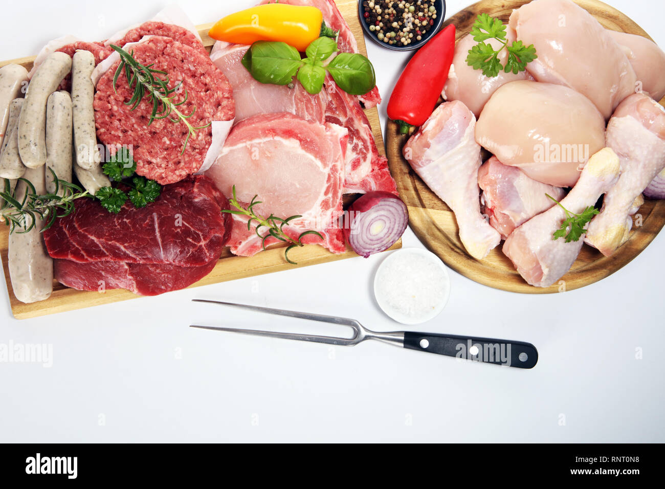 raw meat. Different types of raw pork meat, chicken and beef with ...