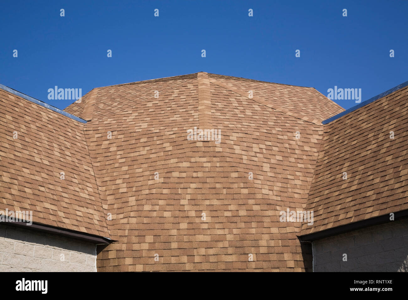 Sloped multilevel brown and beige asphalt shingles roofs Stock Photo ...