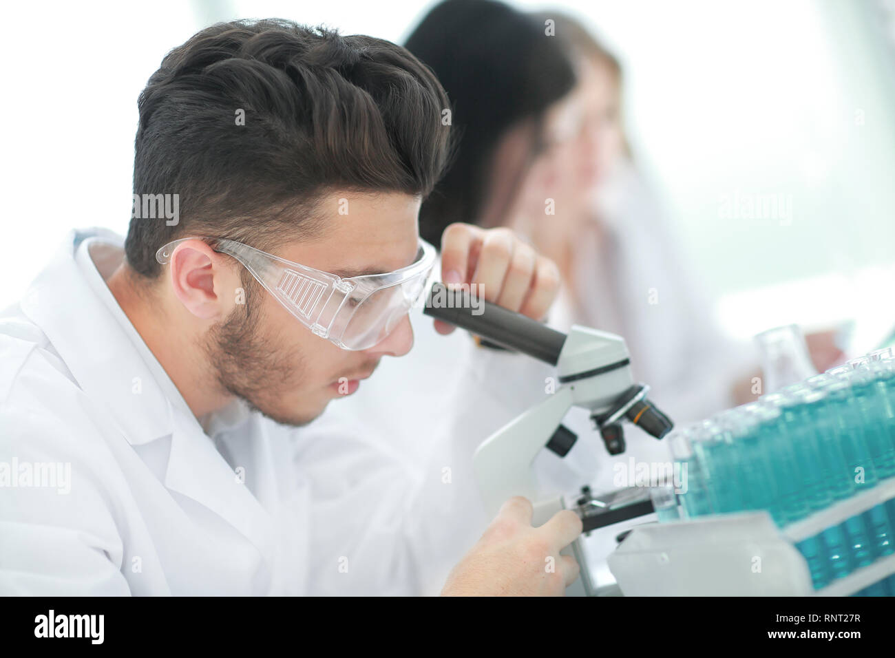 Looking Through A Microscope High Resolution Stock Photography and ...