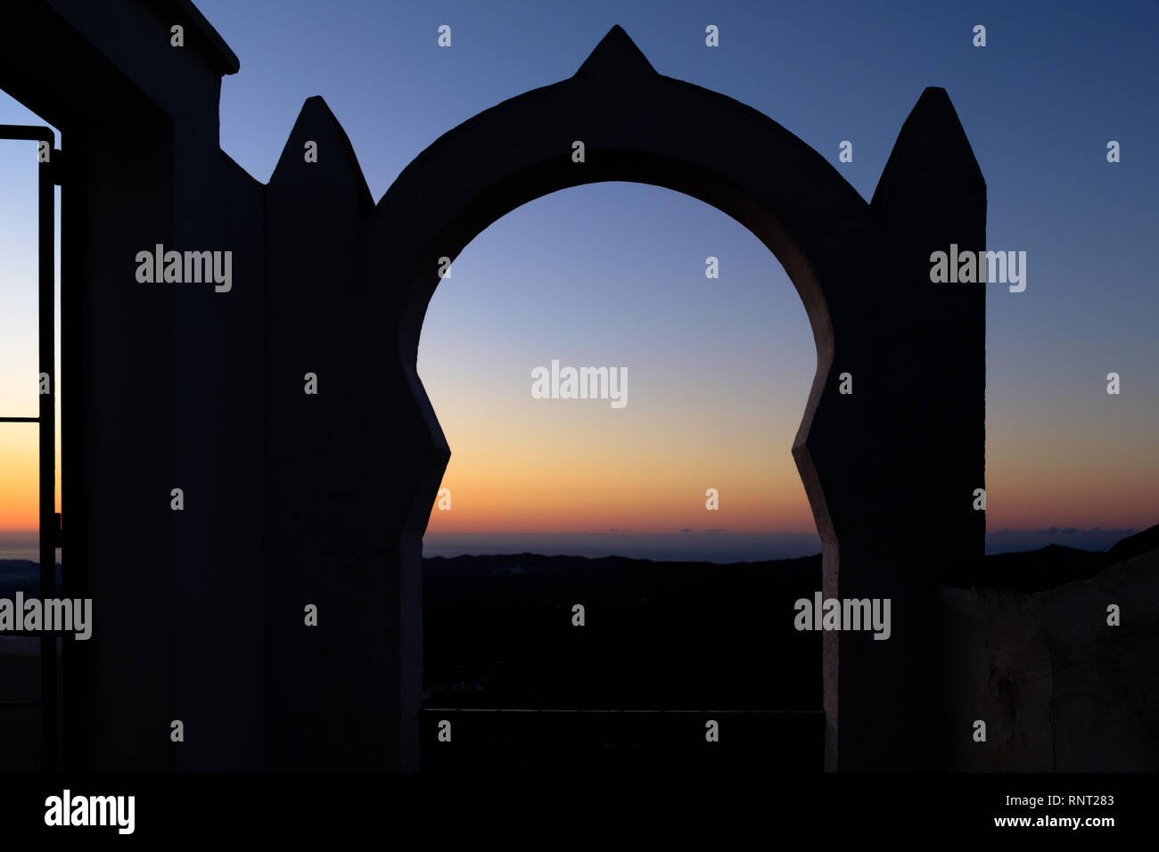 Moorish arch at sunrise in the mountain top village of Comares ...