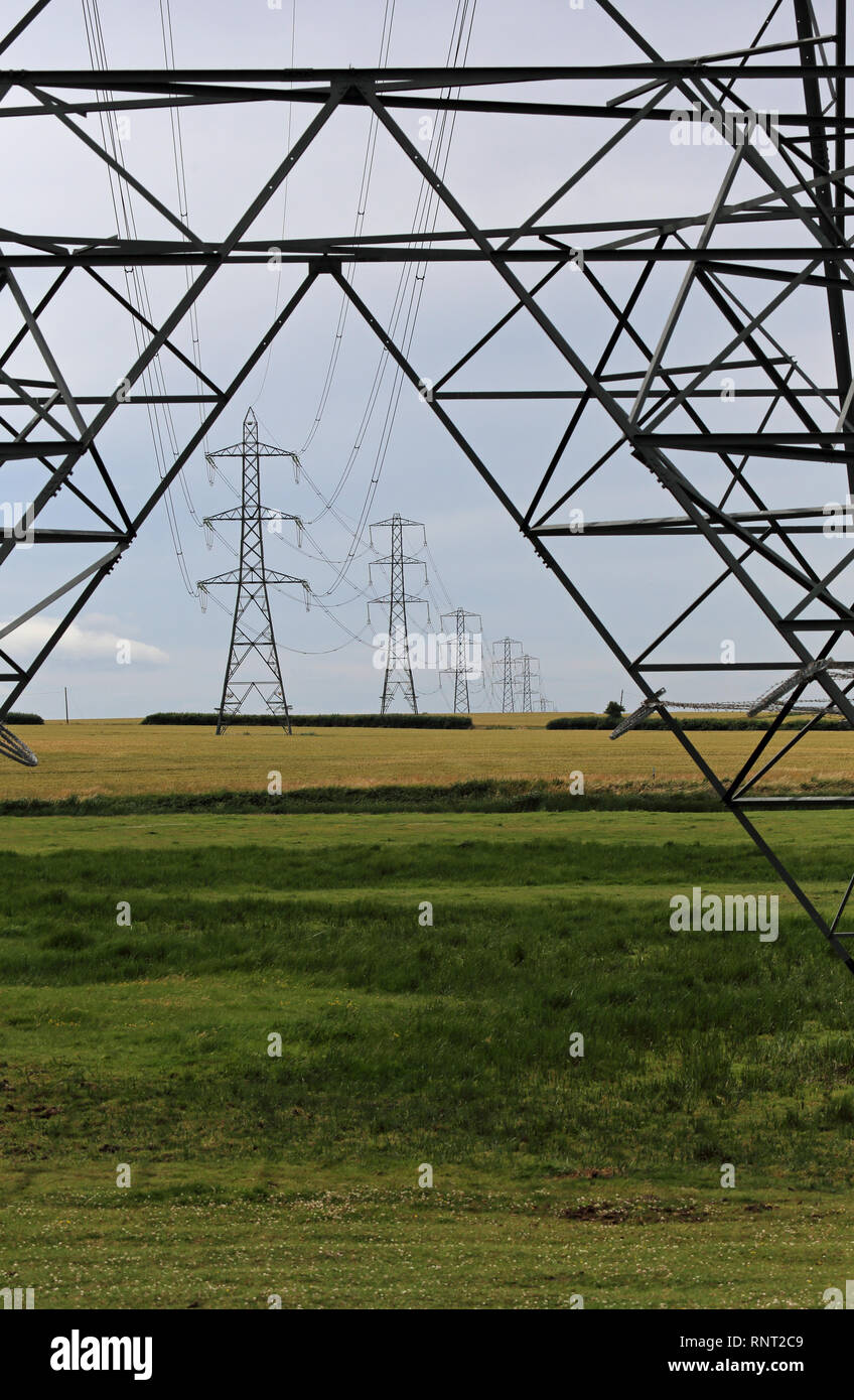 Electricity pylons dominate the landscape at Oare Marshes near ...