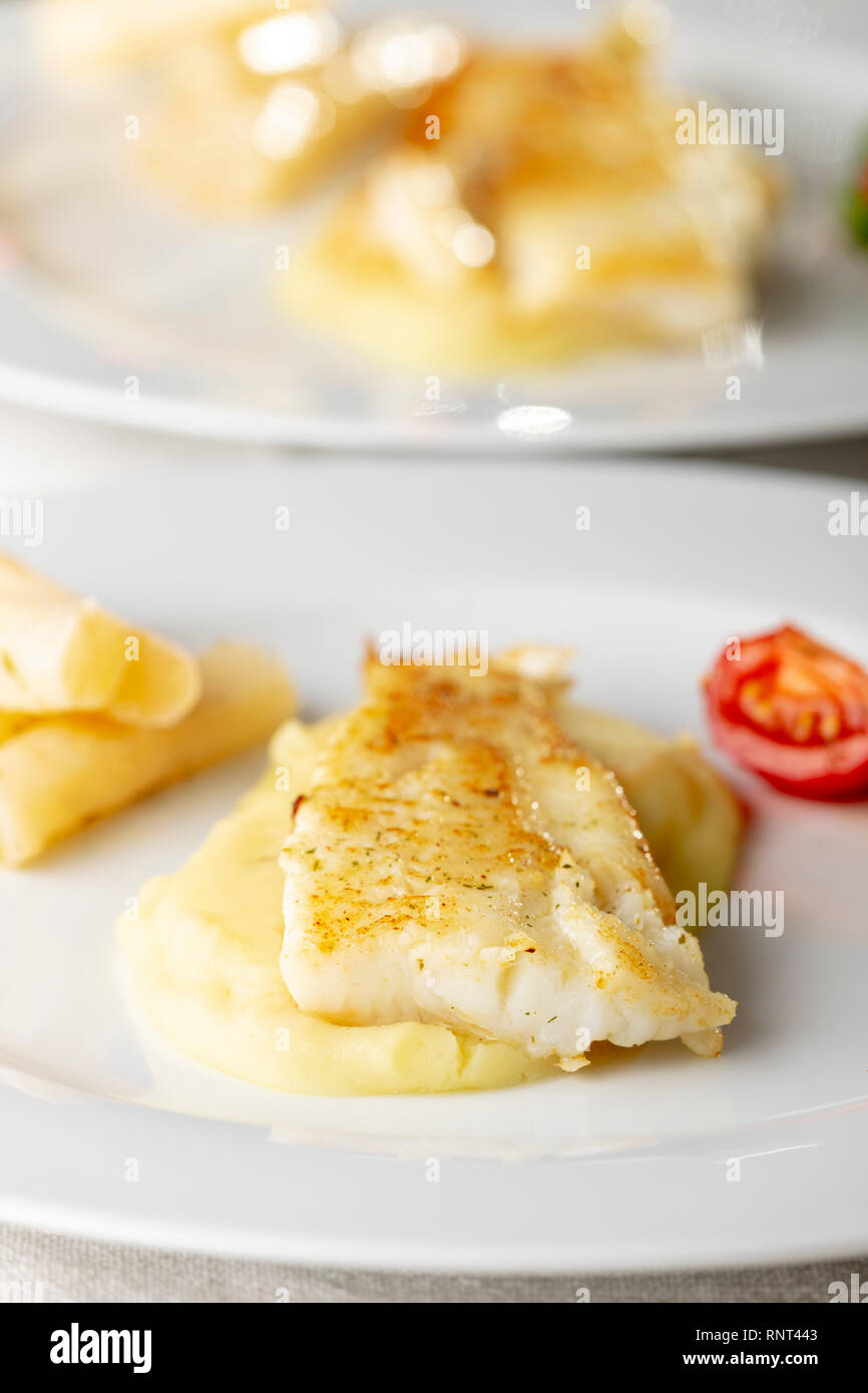 grilled cod on a plate Stock Photo - Alamy