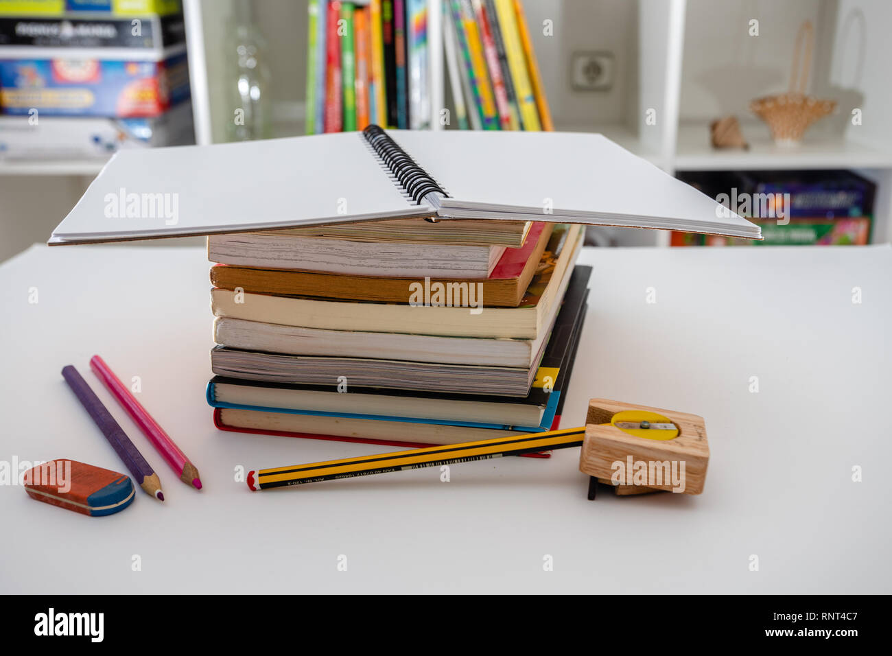 Stack of books and stationery on white background. Doing homework Stock ...