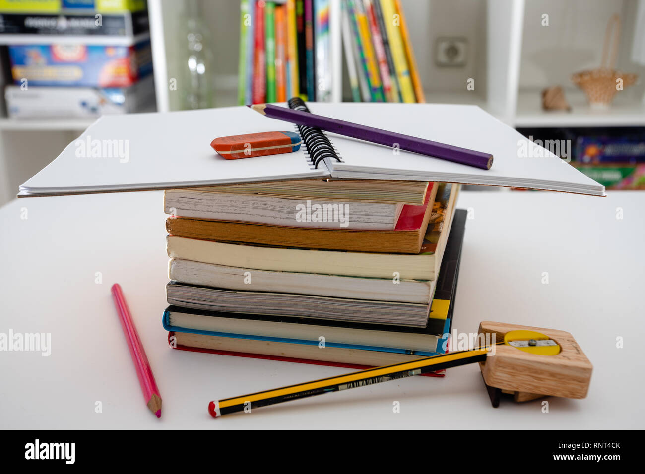 Stack of books and stationery on white background. Doing homework Stock ...