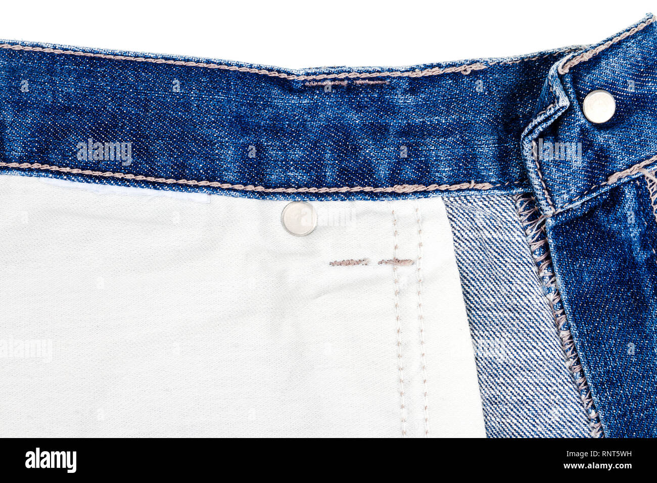 Piece of blue jeans fabric isolated on white background. Rough uneven ...