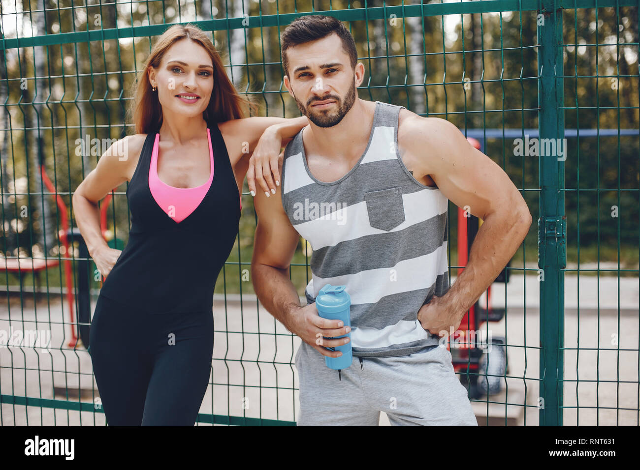 Sports couple in a morning summer park Stock Photo - Alamy