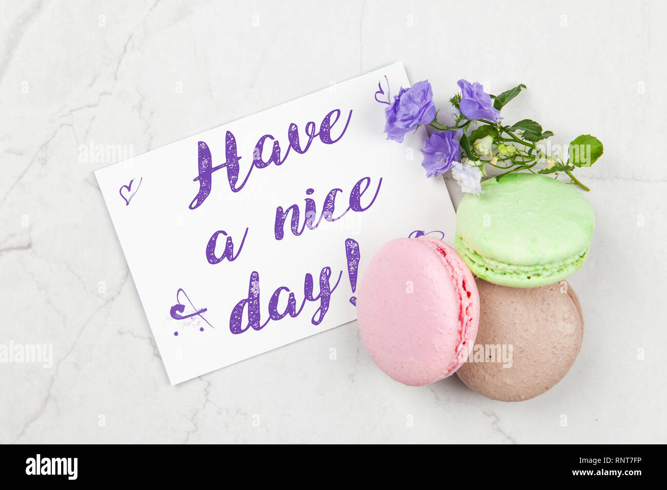 Have a Nice Day note on white marble table Stock Photo - Alamy