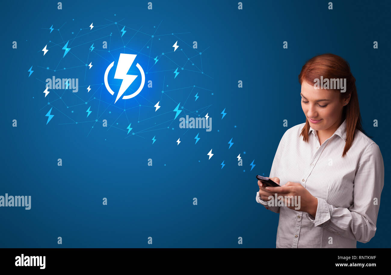 Young person using phone with power concept Stock Photo - Alamy