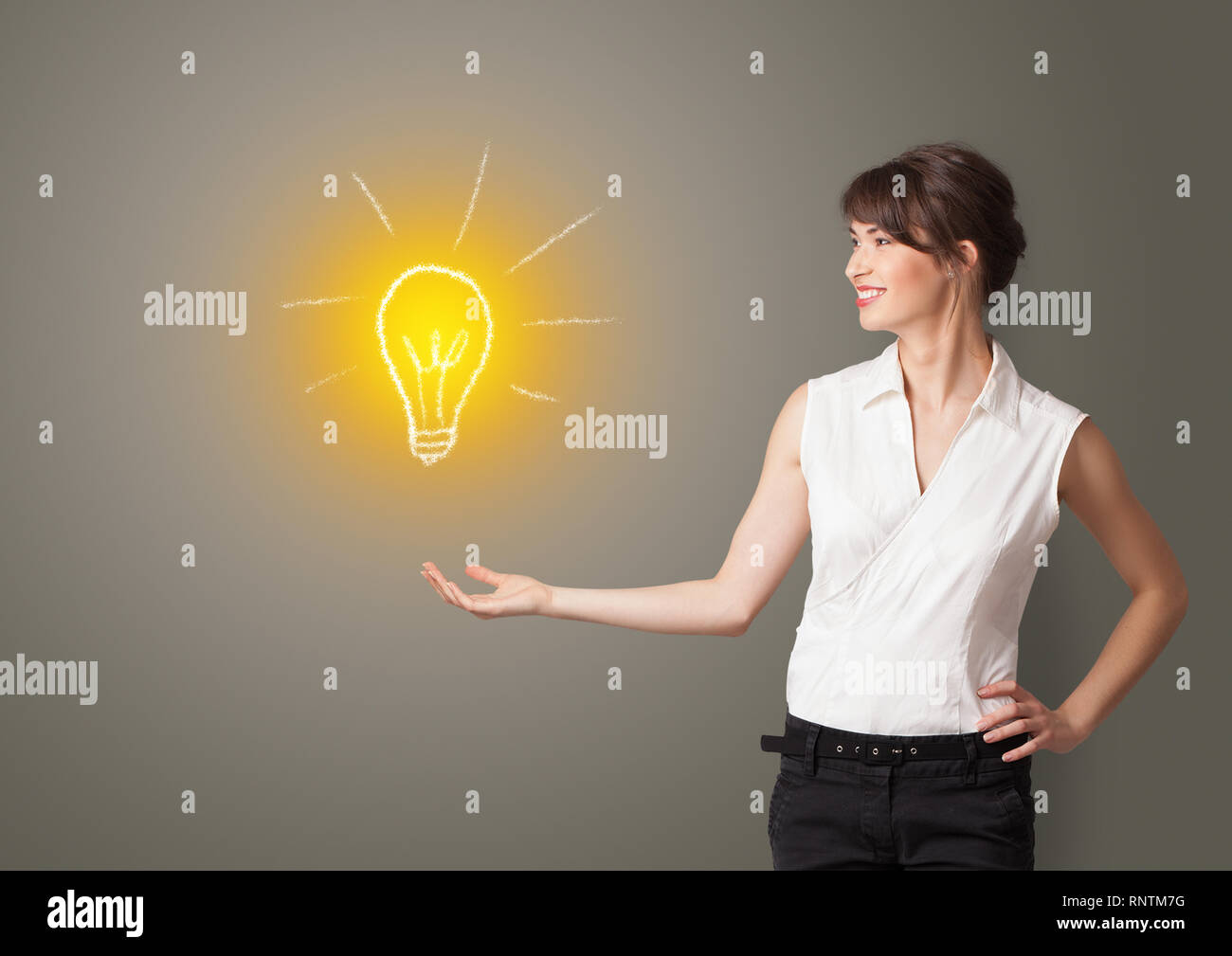 Young smiling person presenting new idea concept Stock Photo - Alamy