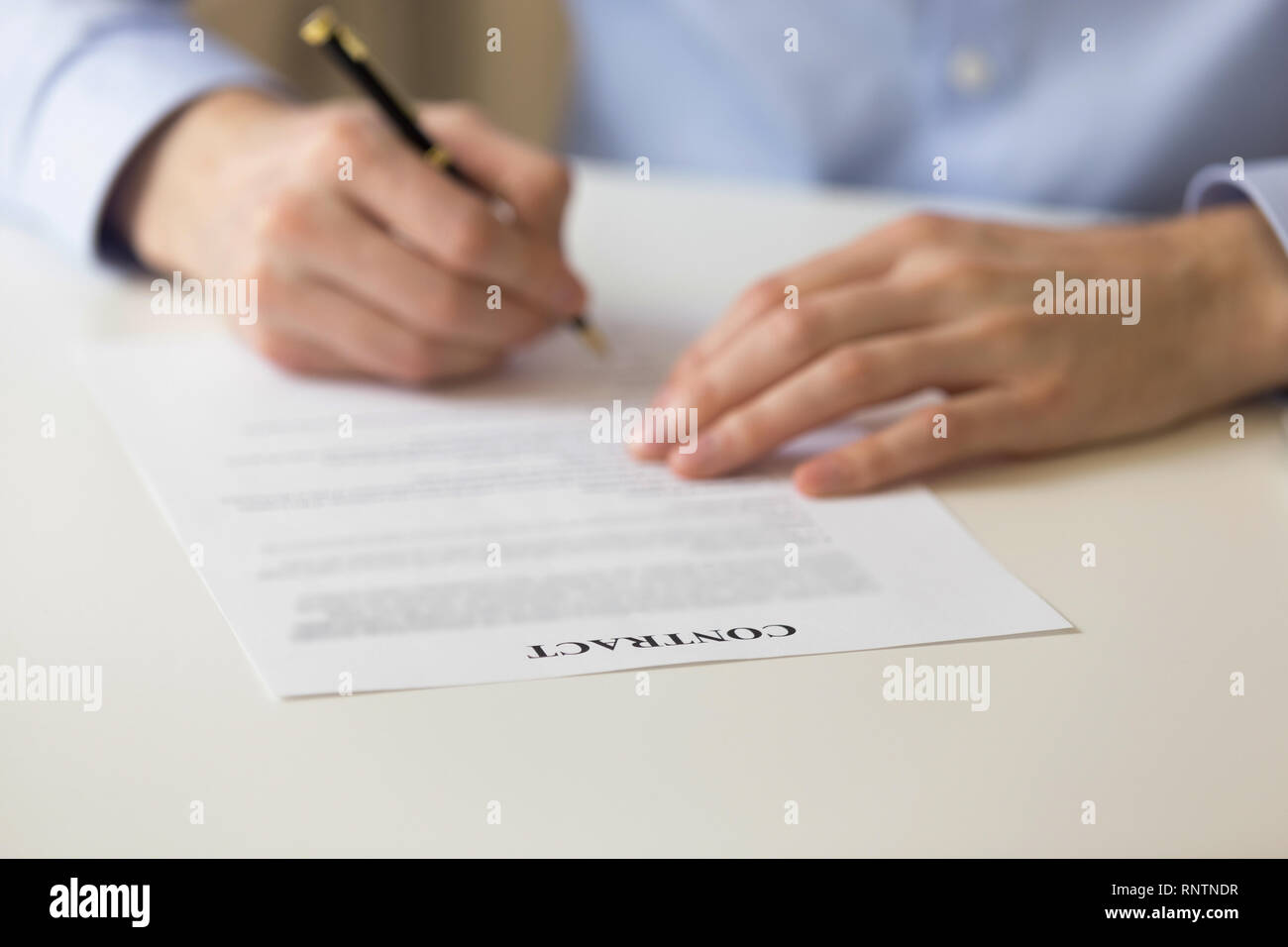 Man signing contract close up hands and document Stock Photo - Alamy