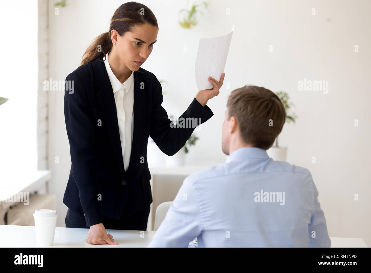 Angry boss scolding unqualified employee telling about mistake in ...