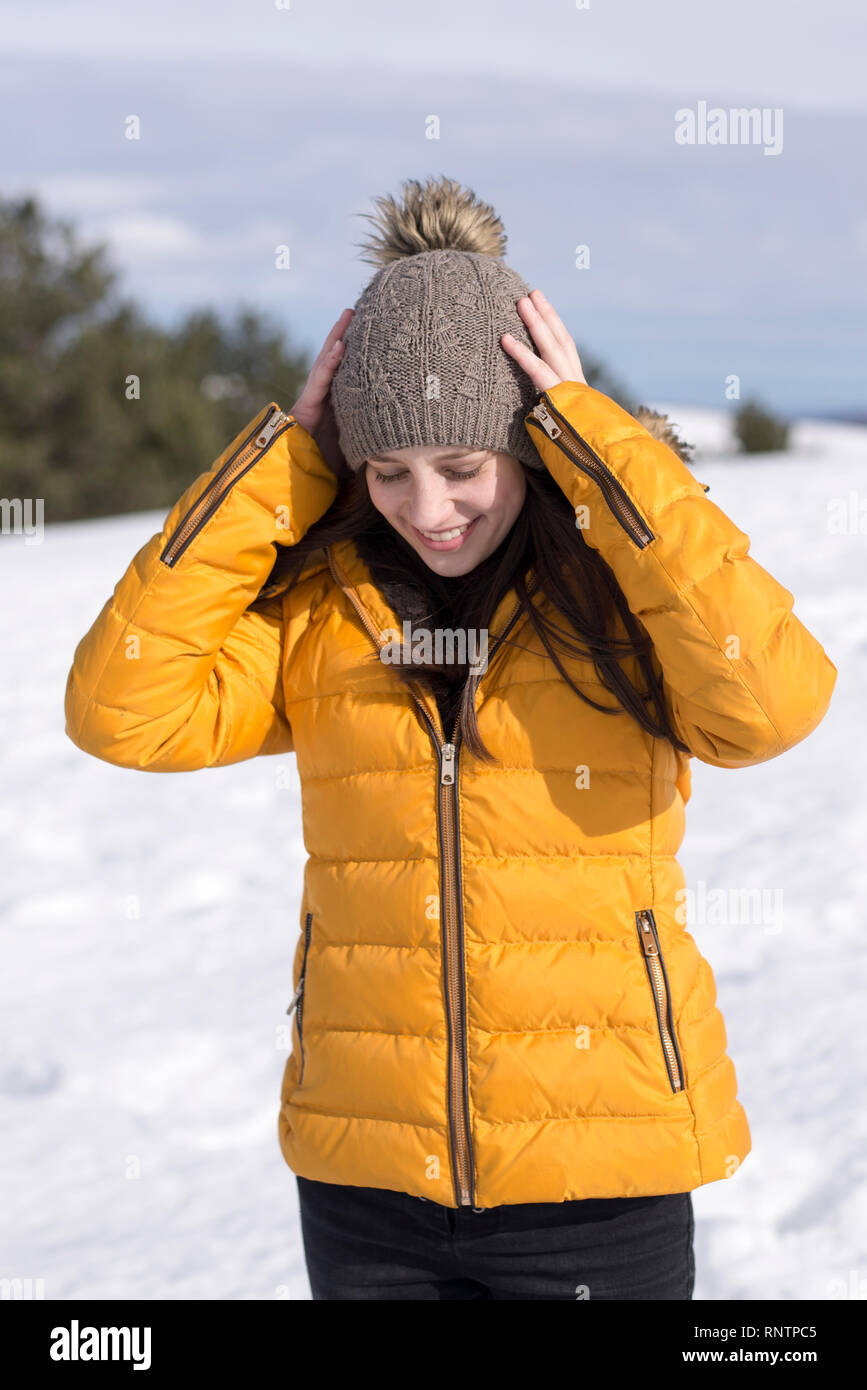 Beautiful girl in yellow jacket modeling Stock Photo - Alamy