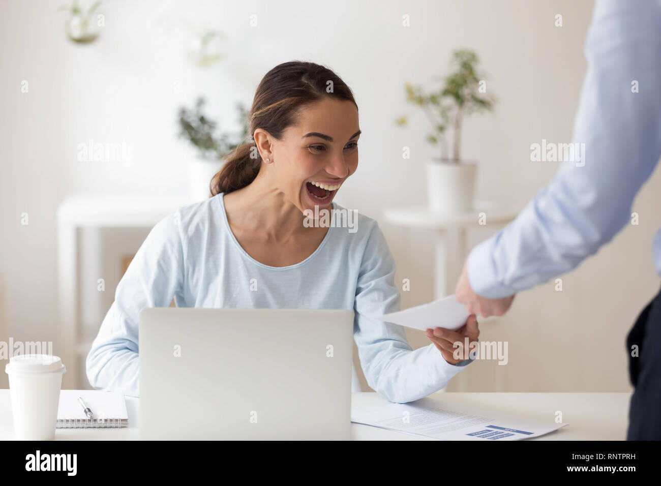 Happy woman receiving money hi-res stock photography and images - Alamy
