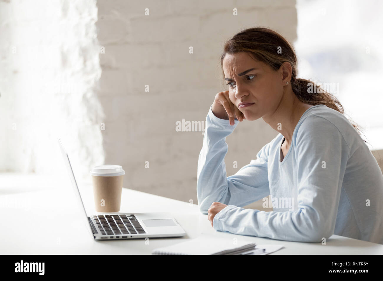Confused student looking laptop screen hi-res stock photography and ...