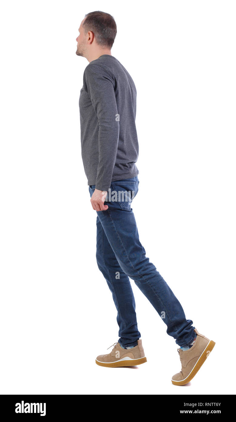 Side view of going handsome man. walking young guy . Rear view people ...