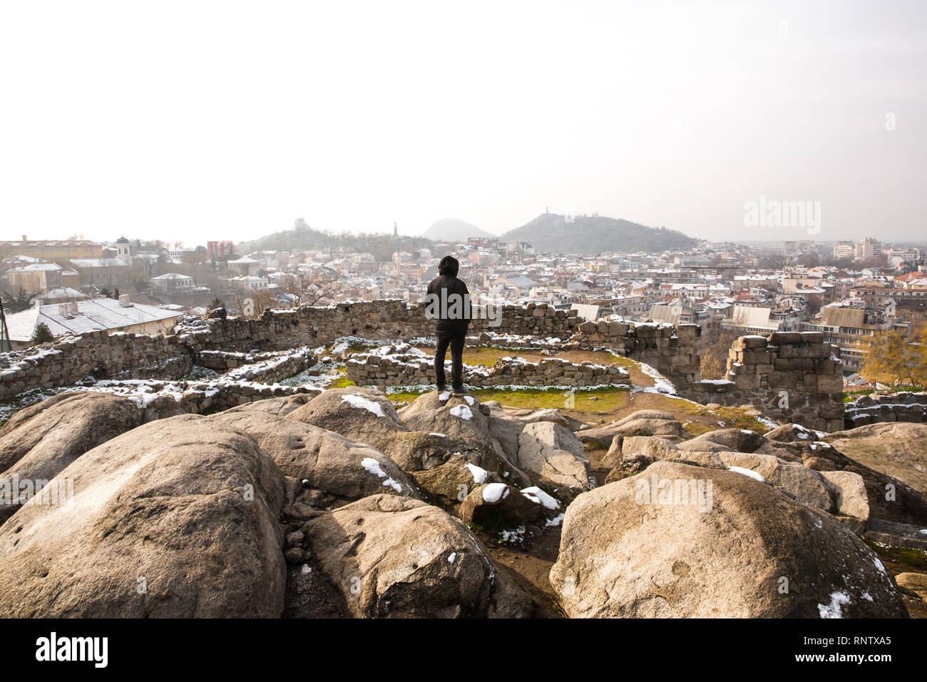 A man stands atop a view in Plovdiv, Bulgaria also known as the City of ...