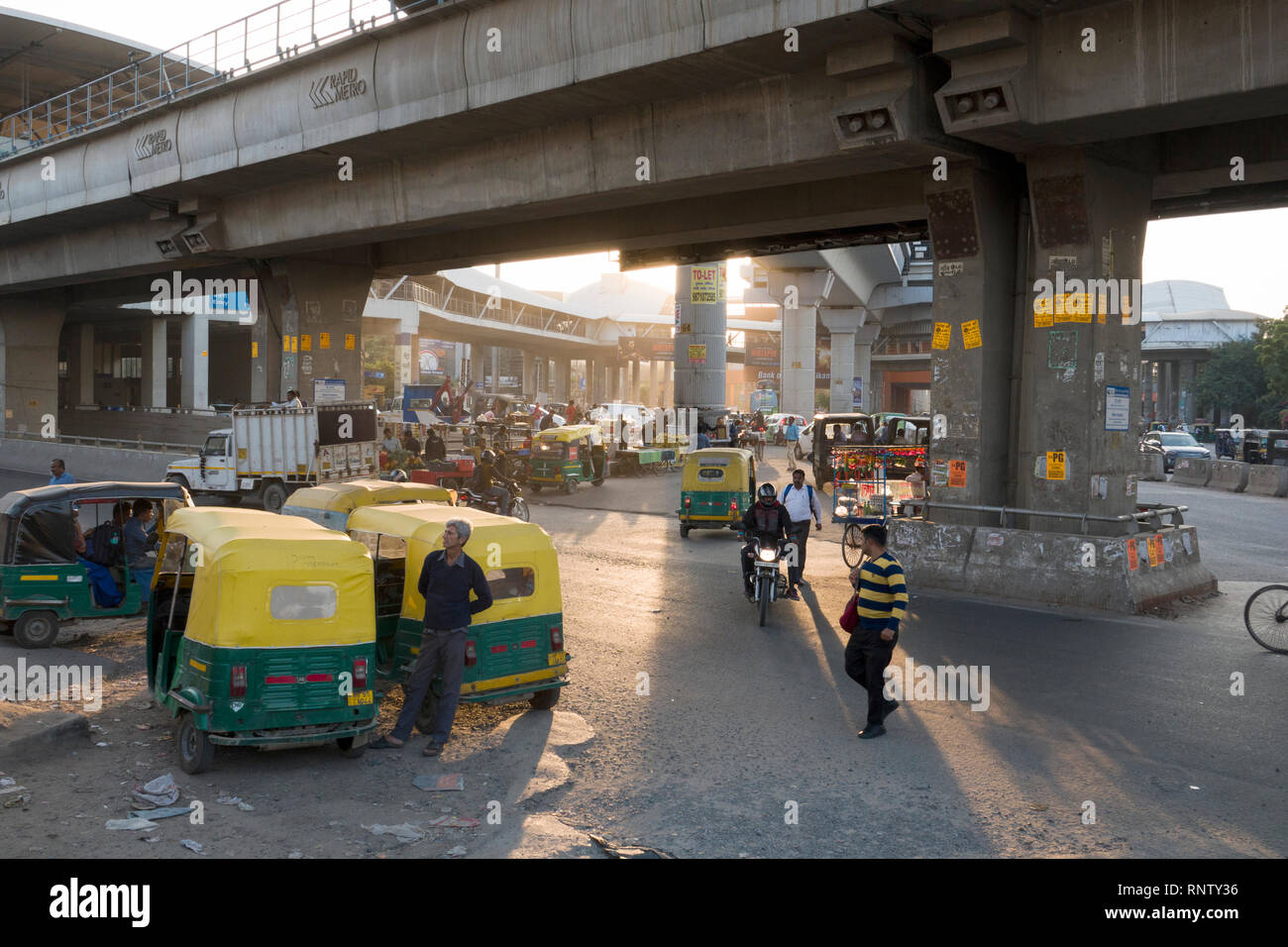 Pedestrians and traffic under the overpass at Dhaula Kuan in New Delhi ...