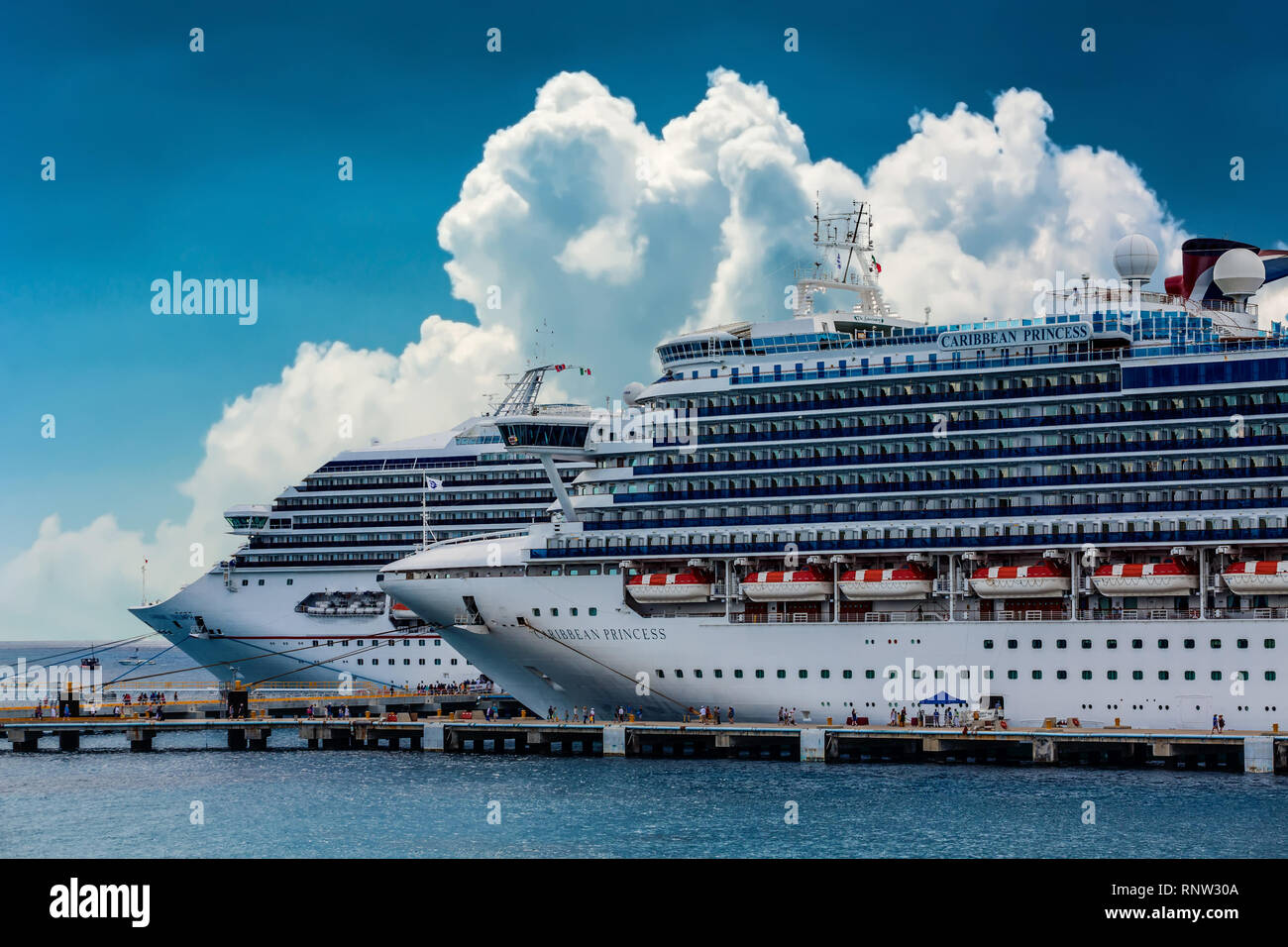 Caribbean Princess and Carnival Triumph Stock Photo - Alamy
